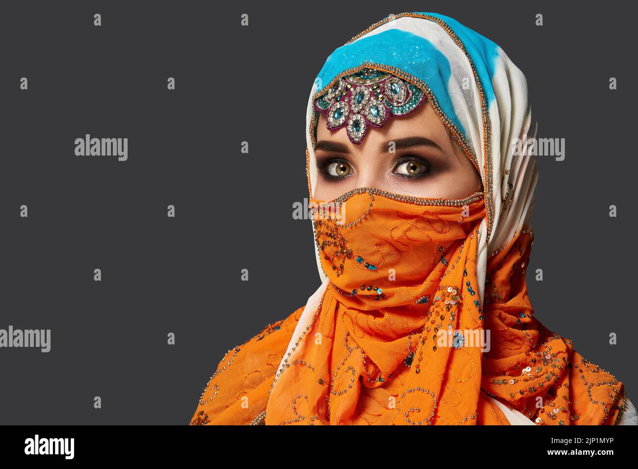 Studio shot of a chrming female wearing the colorful hijab decorated ...