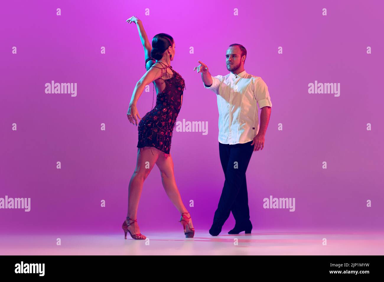 Beautiful coupleof dancers in adorable attires dancing ballroom dance ...
