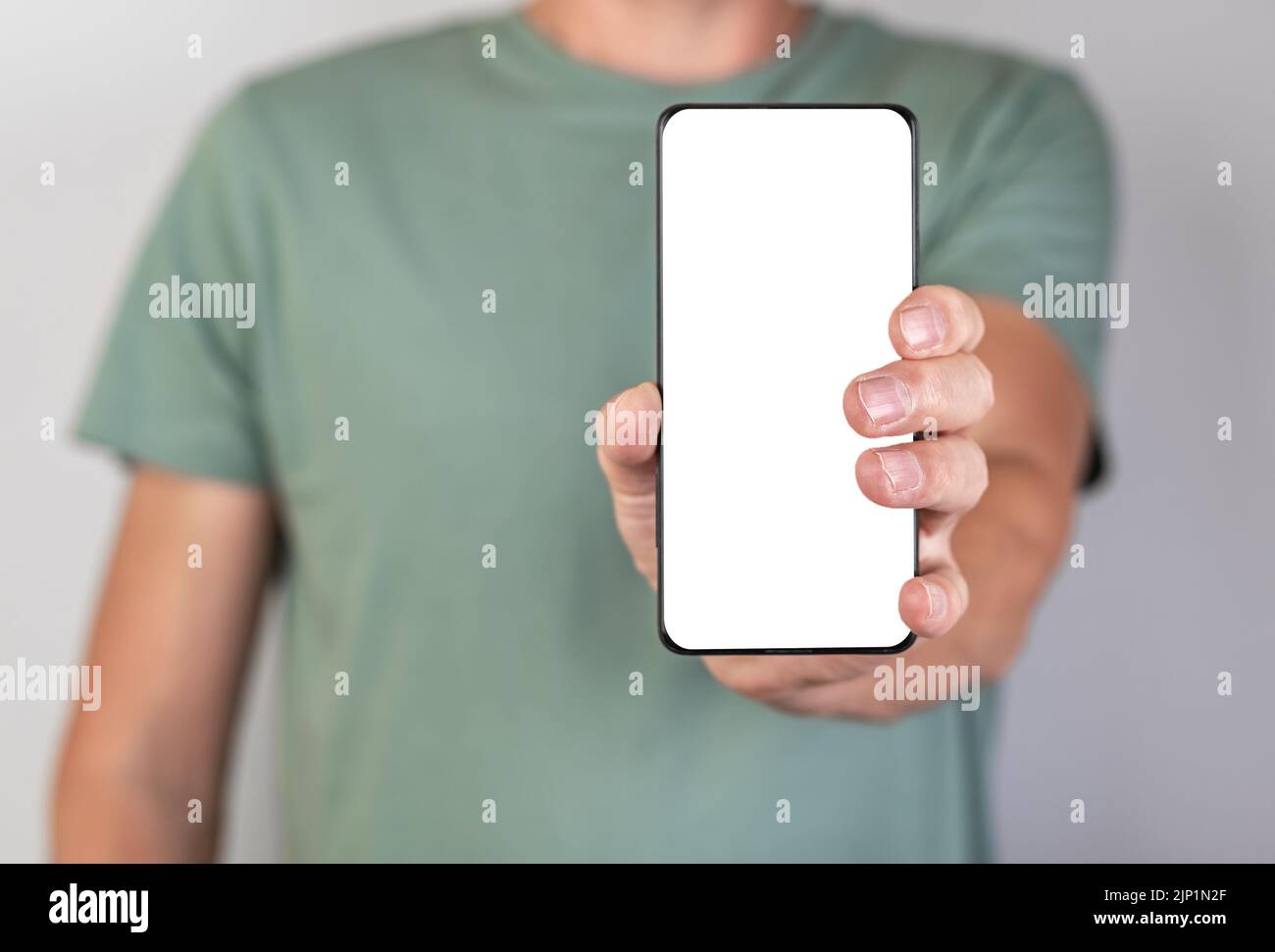 Man holding phone mockup in vertical position. Android with blank ...