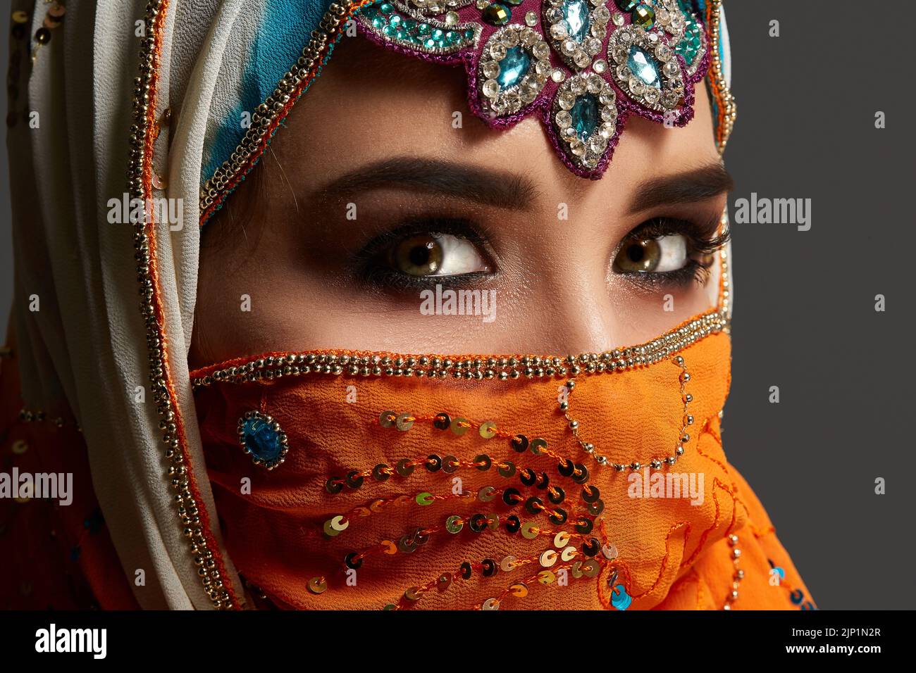 Studio shot of a chrming female wearing the colorful hijab decorated ...