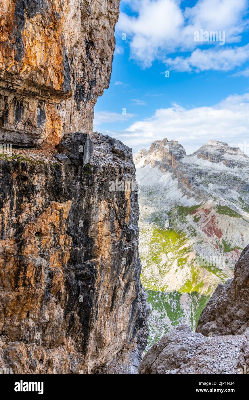 Tourist path in vertical wall of high mountain Stock Photo - Alamy