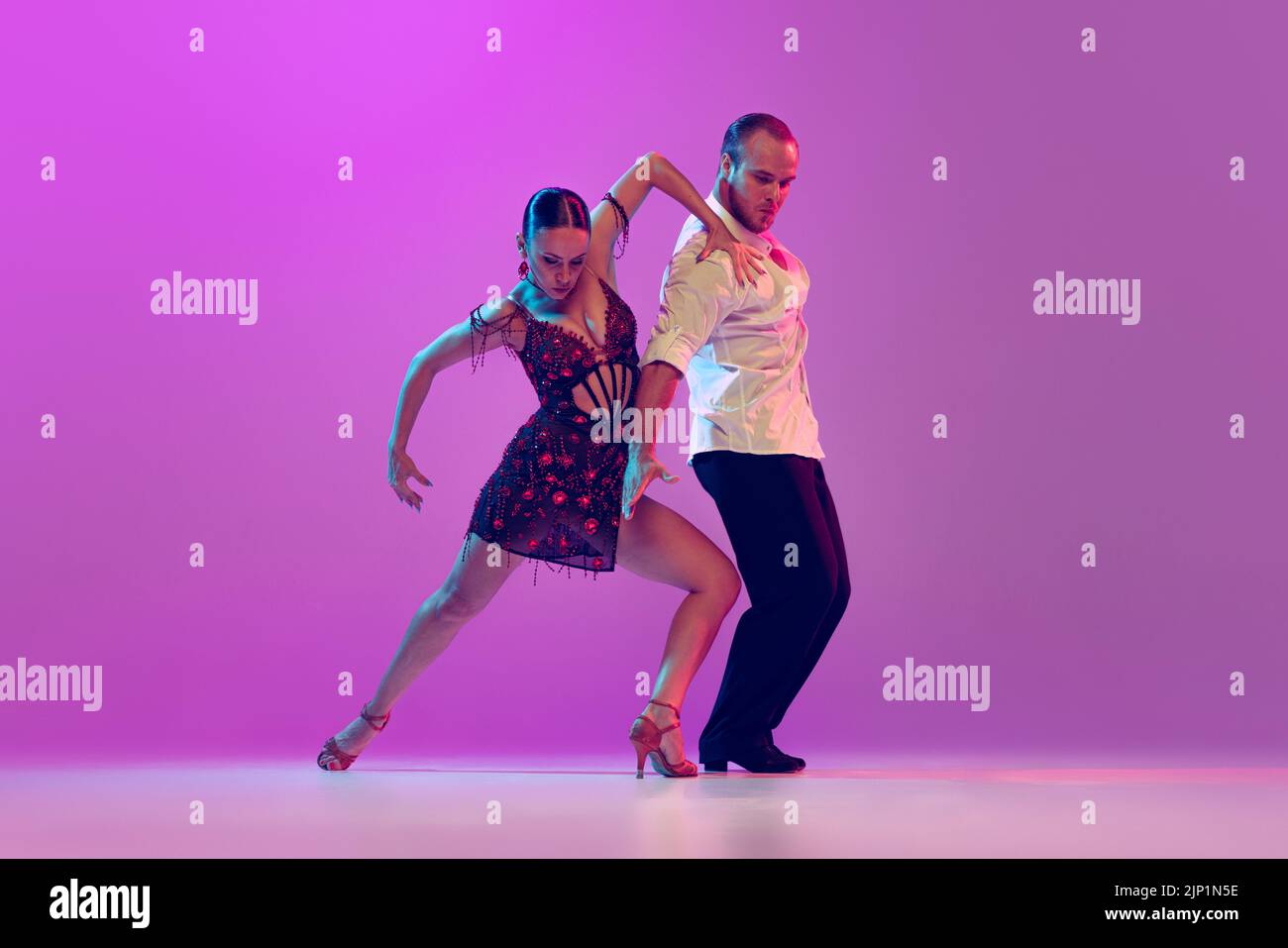 Beautiful coupleof dancers in adorable attires dancing ballroom dance ...