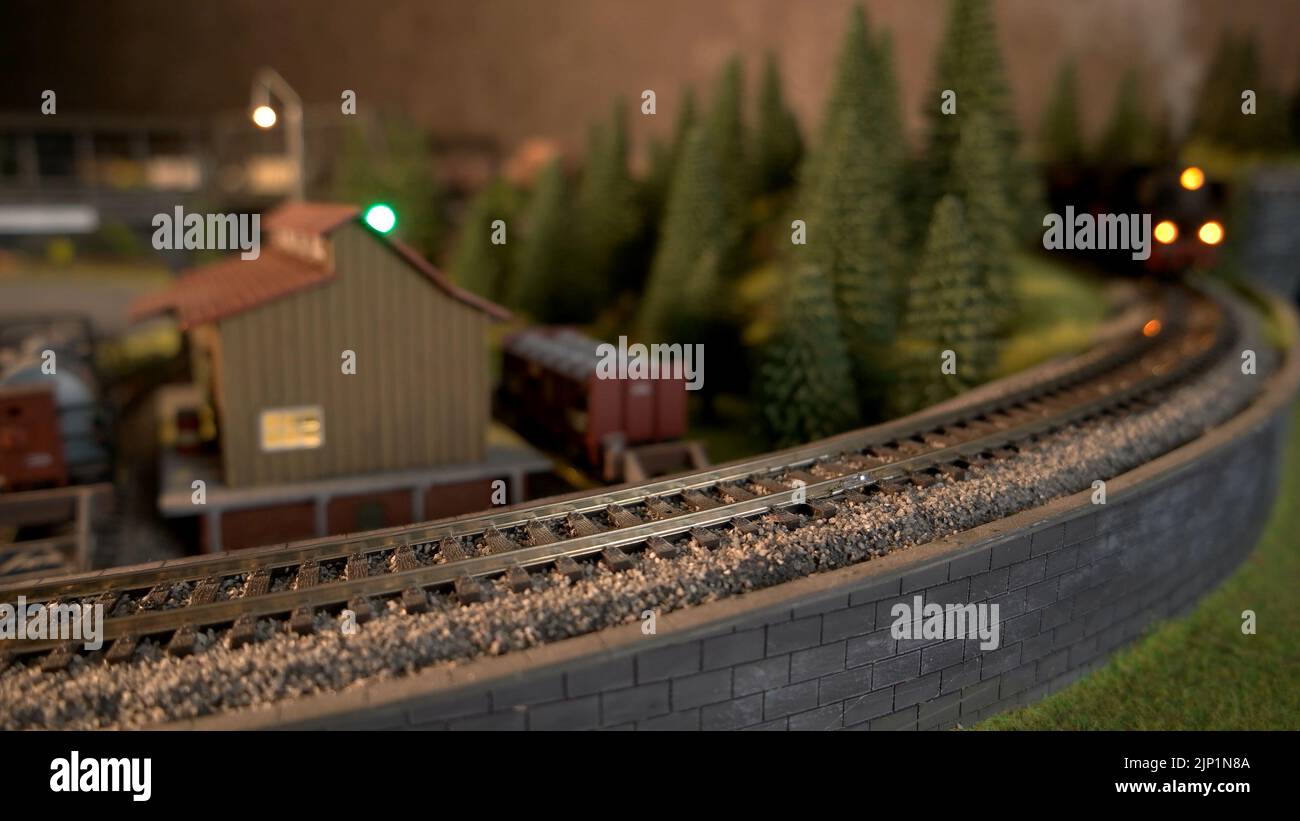 Miniature freight train moving on miniature railroad. Model of railway ...