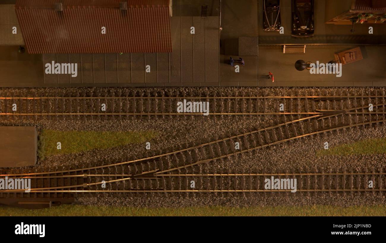 Top view of miniature of railway station. People on the station ...