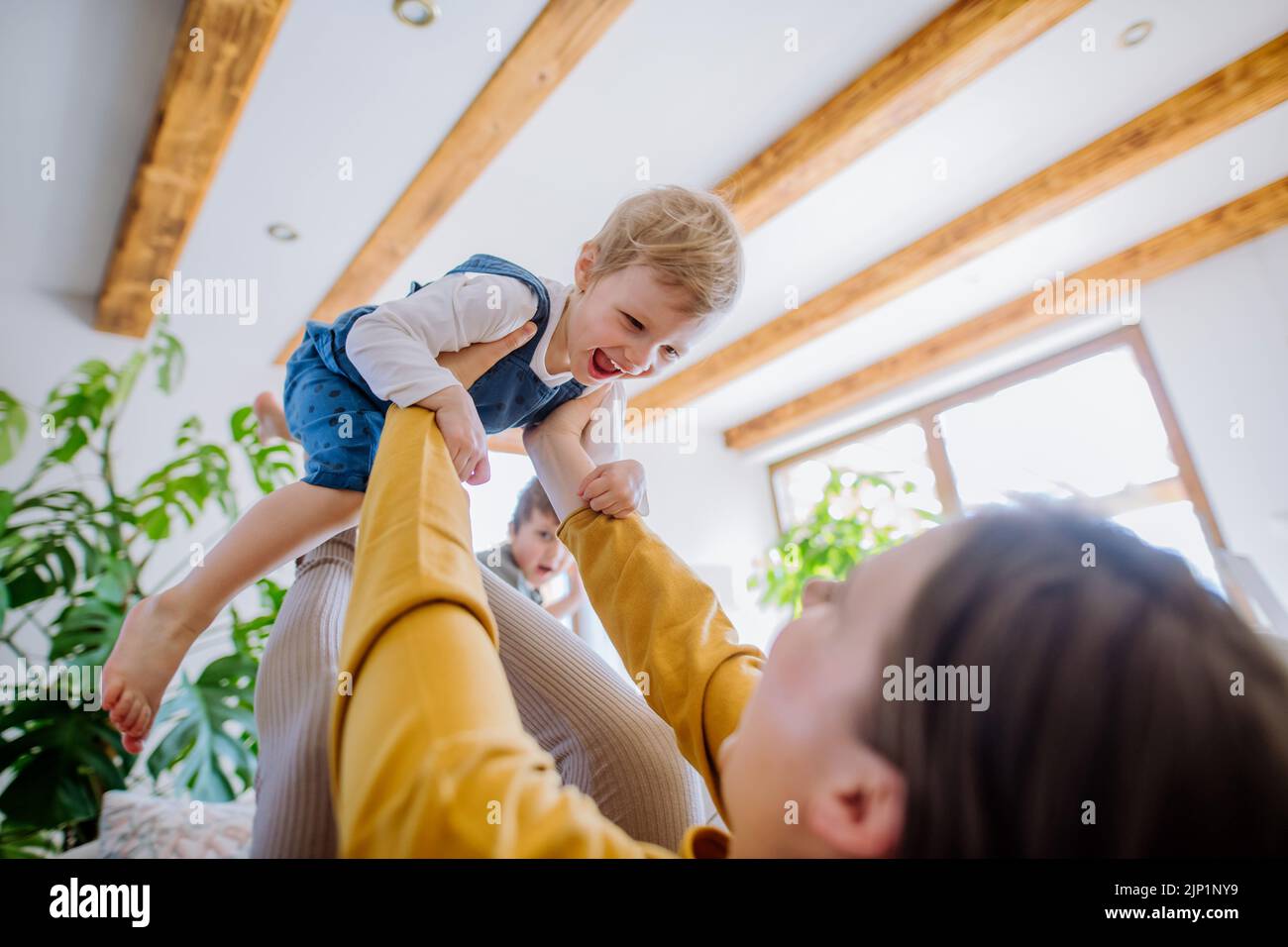 Mother lifting up her child hi-res stock photography and images - Alamy