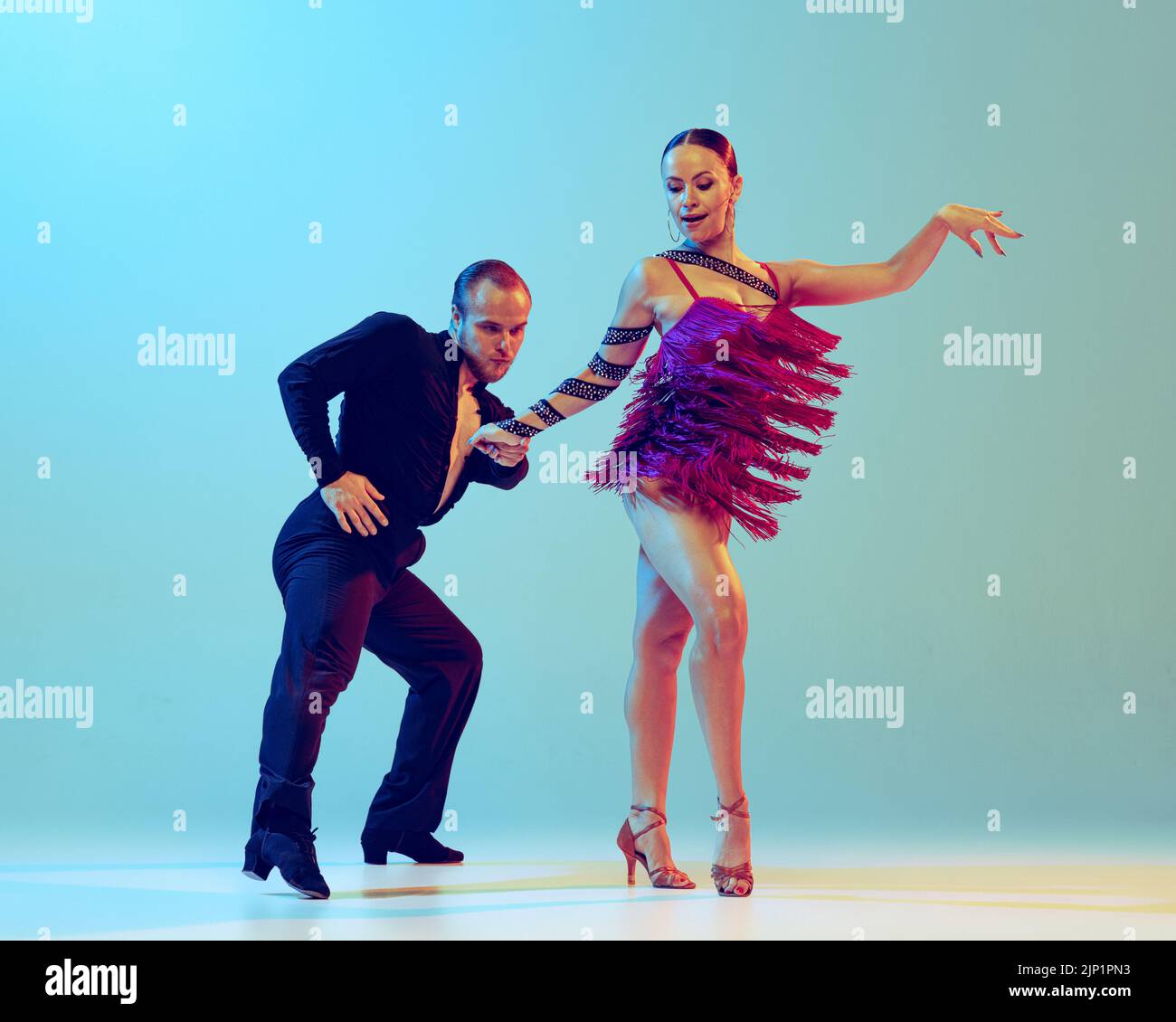 Beautiful woman and man, professional dancers dancing ballroom dance ...