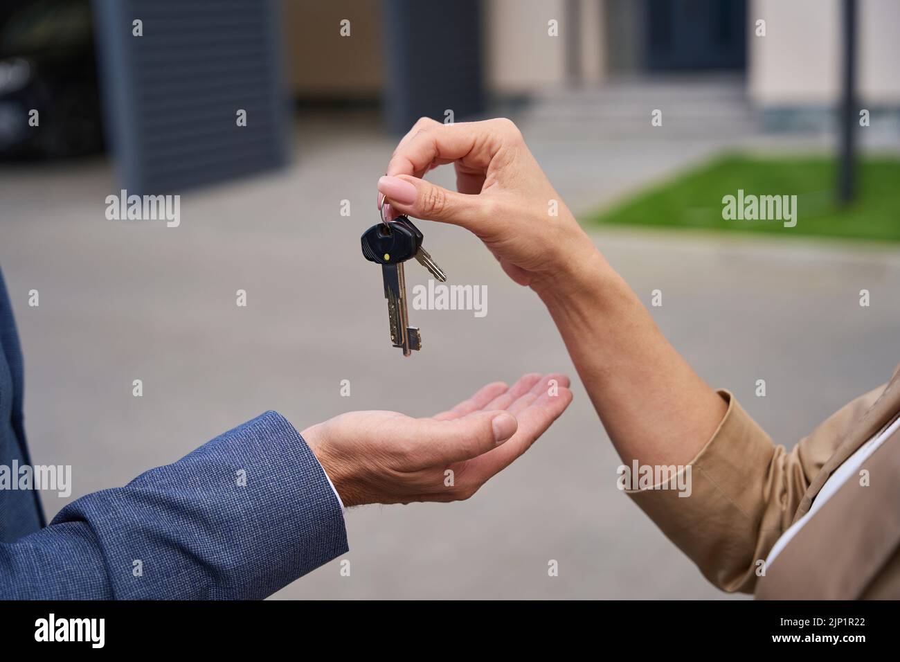 Male hand handing house hi-res stock photography and images - Alamy