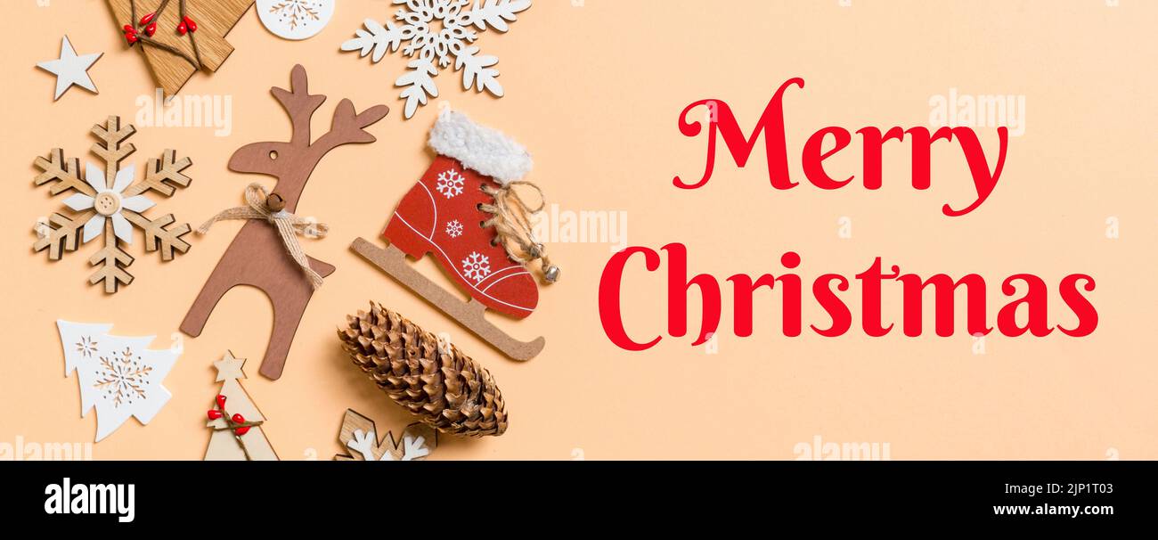 Merry Christmas text. Top view of New Year toys and decorations on ...