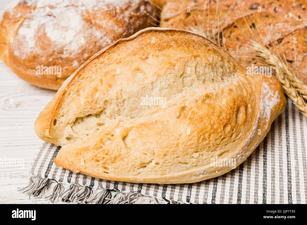 Homemade natural breads. Different kinds of fresh bread as background ...