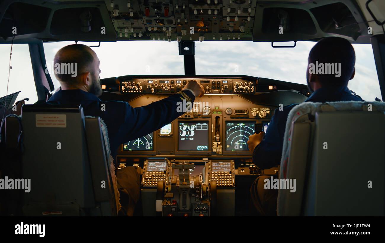 Captain switching buttons to fix altitude and longitude on cockpit ...