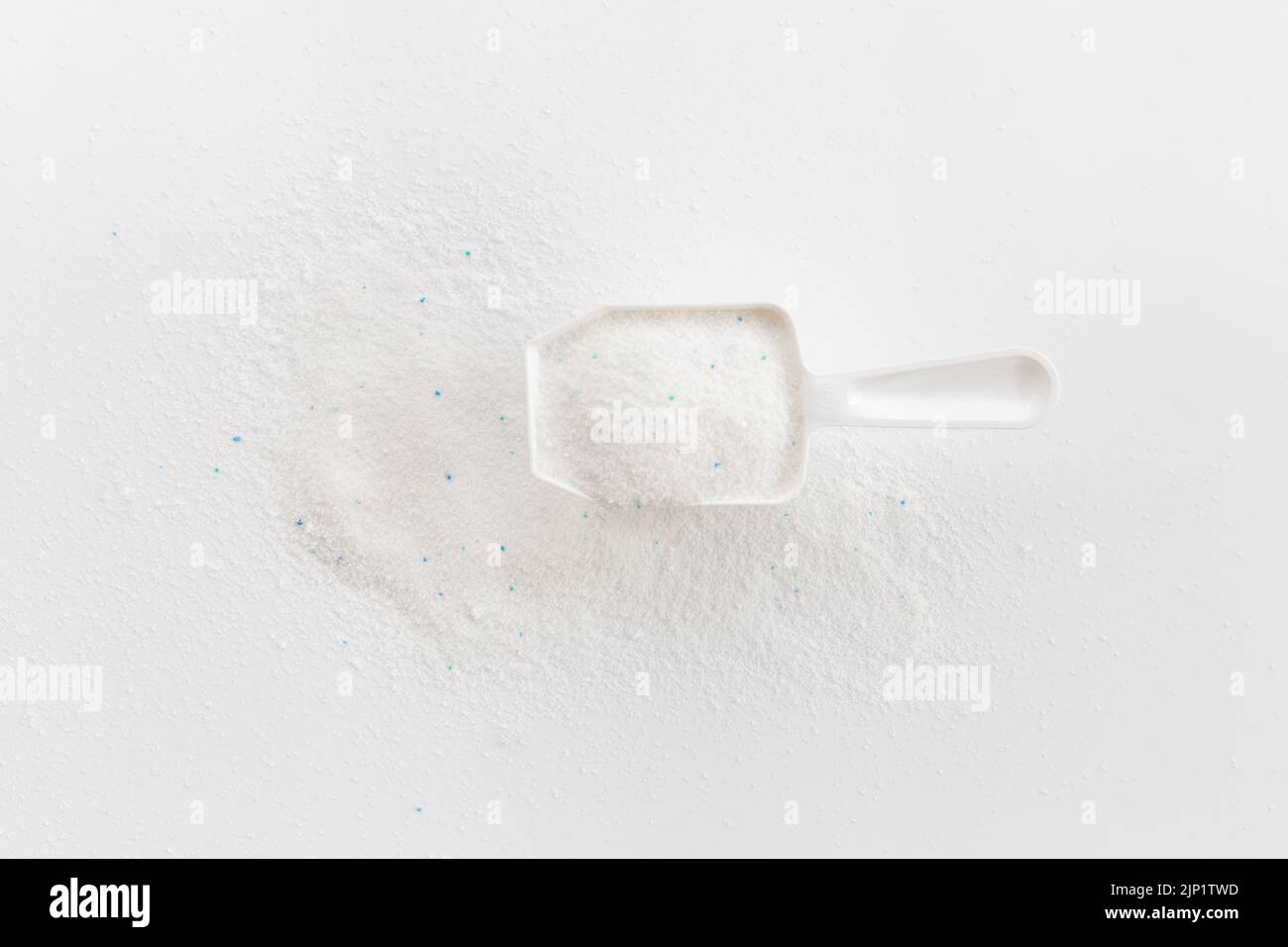 White washing powder with measuring cup. Laundry day concept Stock ...