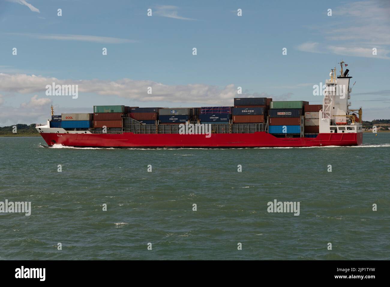 Southampton Water, southern England, UK. 2022. A small container ship ...