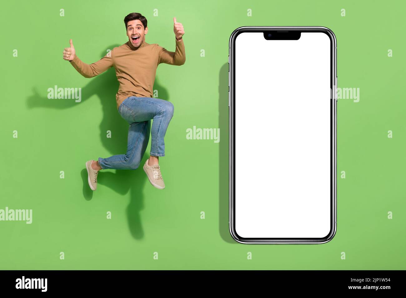 Photo of confident reliable guy jump raise thumbs up wear beige shirt ...