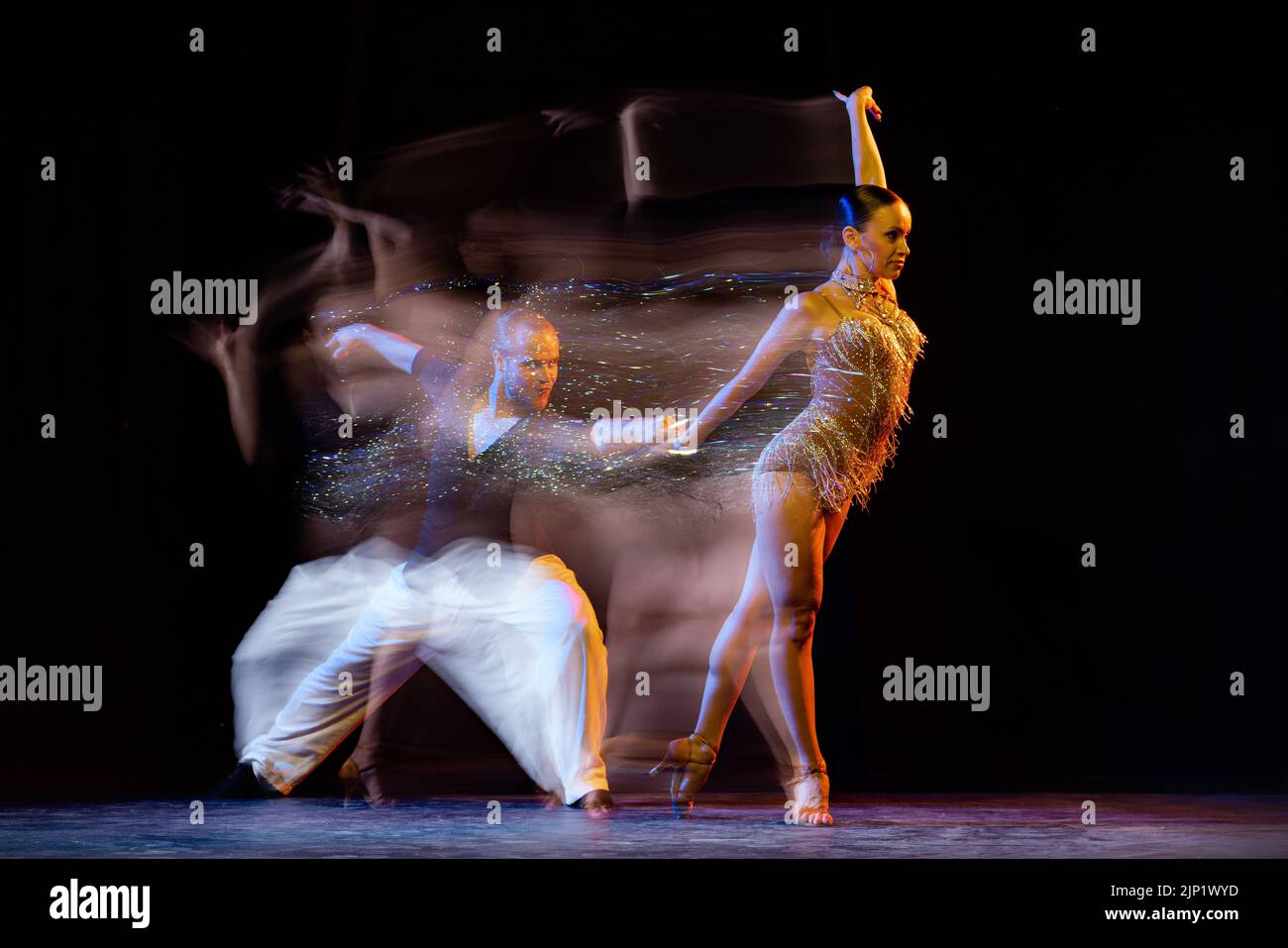 Energy in movements. Two professional dancers dancing ballroom dance ...