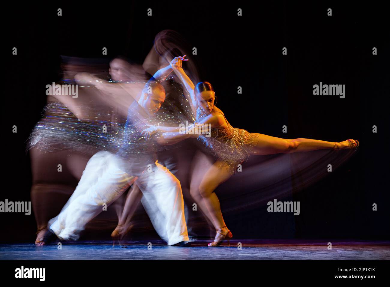 Energy in movements. Two professional dancers dancing ballroom dance ...