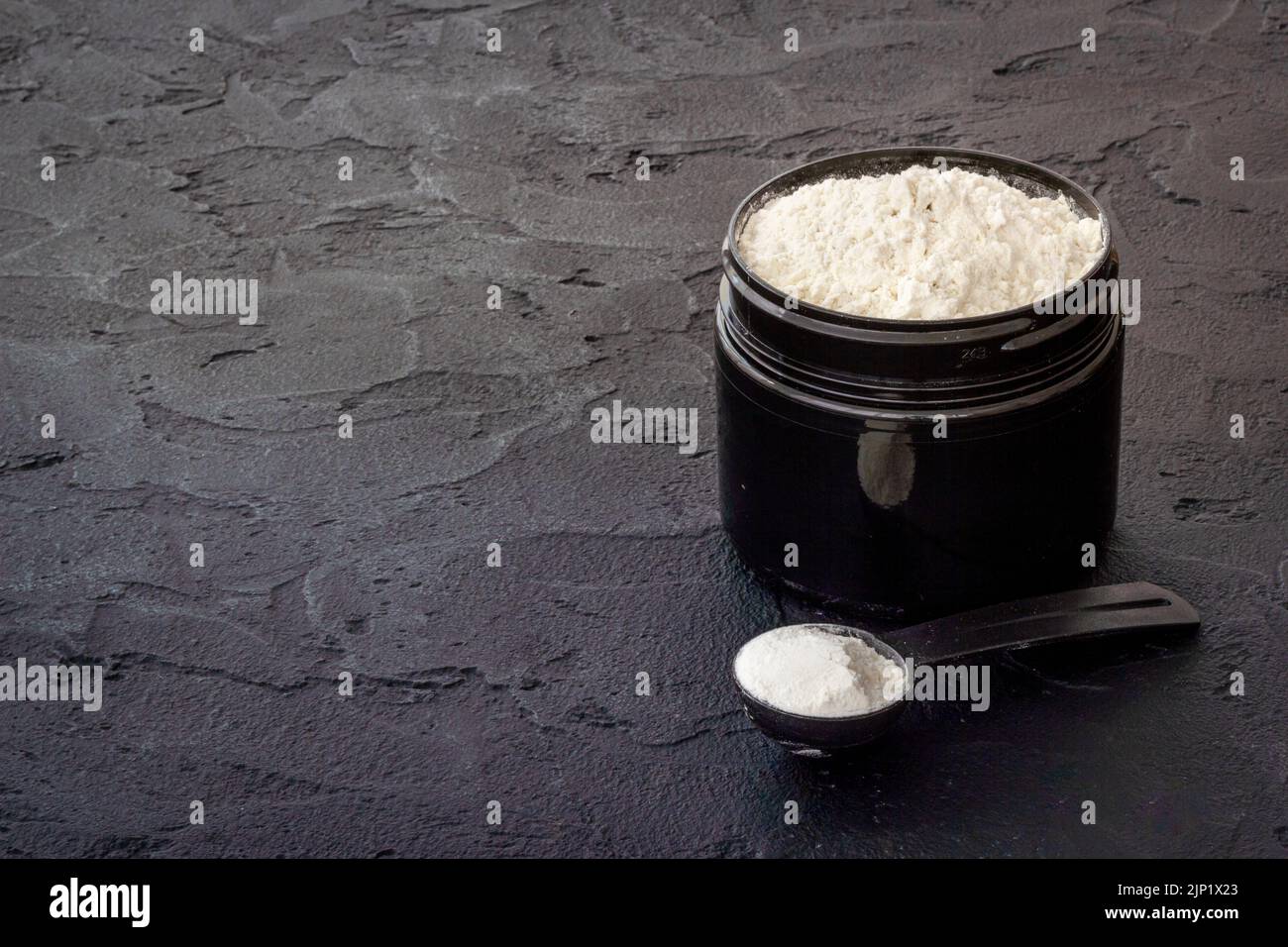 Sports nutrition. Whey protein powder in jar. Fitness and gym diet ...