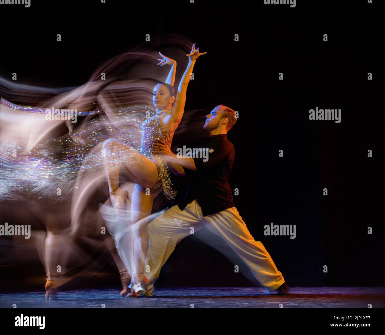 Flight of feelings. Two professional dancers dancing ballroom dance ...