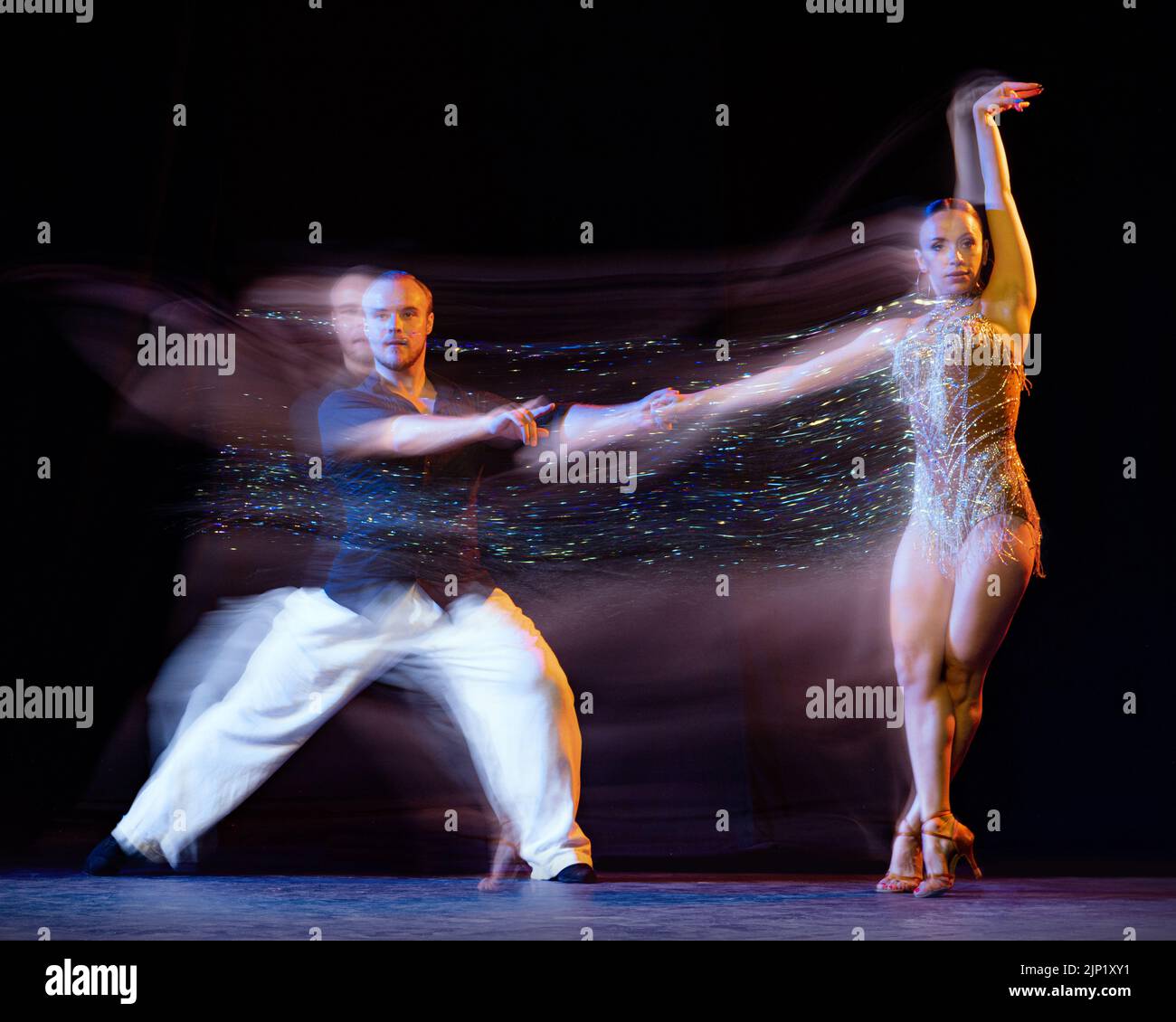 Energy in movements. Two professional dancers dancing ballroom dance ...
