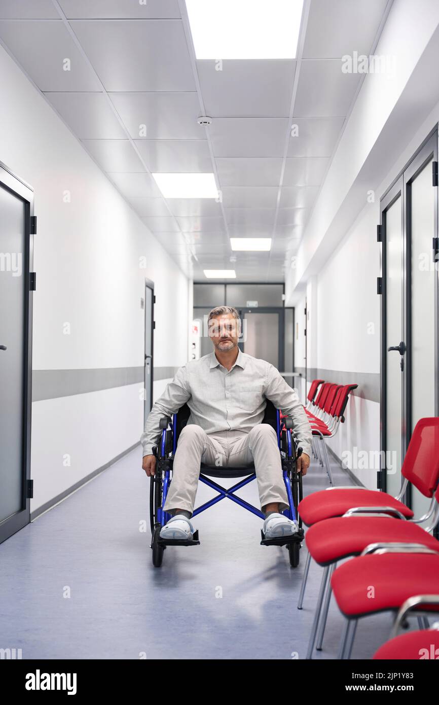 Adult caucasian male sitting in a wheelchair for the disabled on the ...
