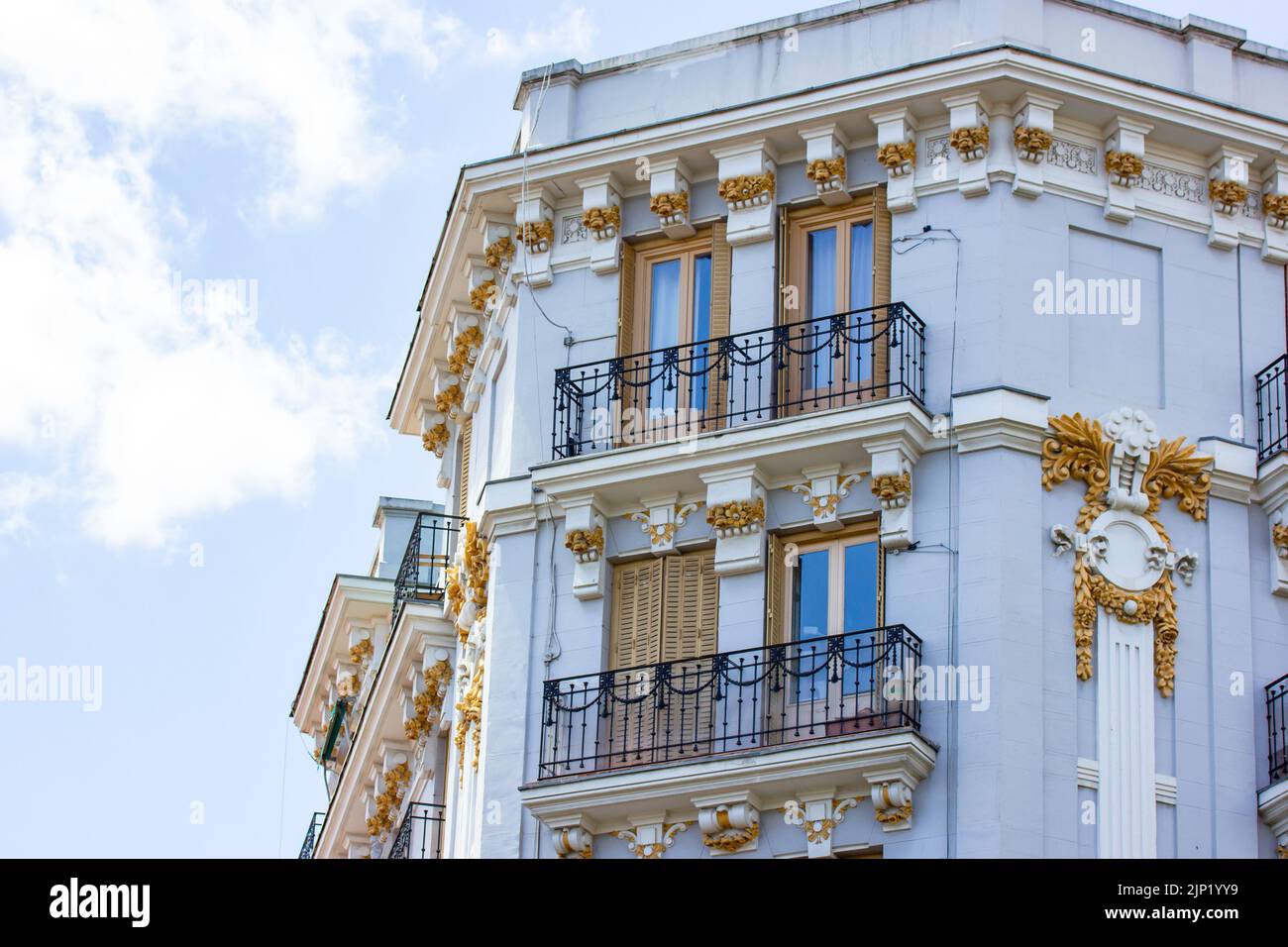 Corner of a residential building with decorated blue facade Vintage ...