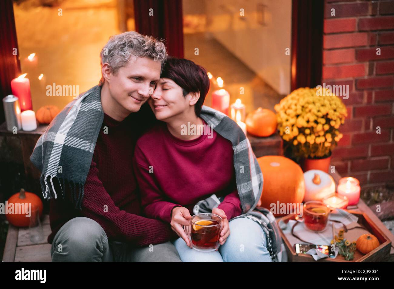 A couple having a romantic date on the porch of their home. Cozy ideas ...