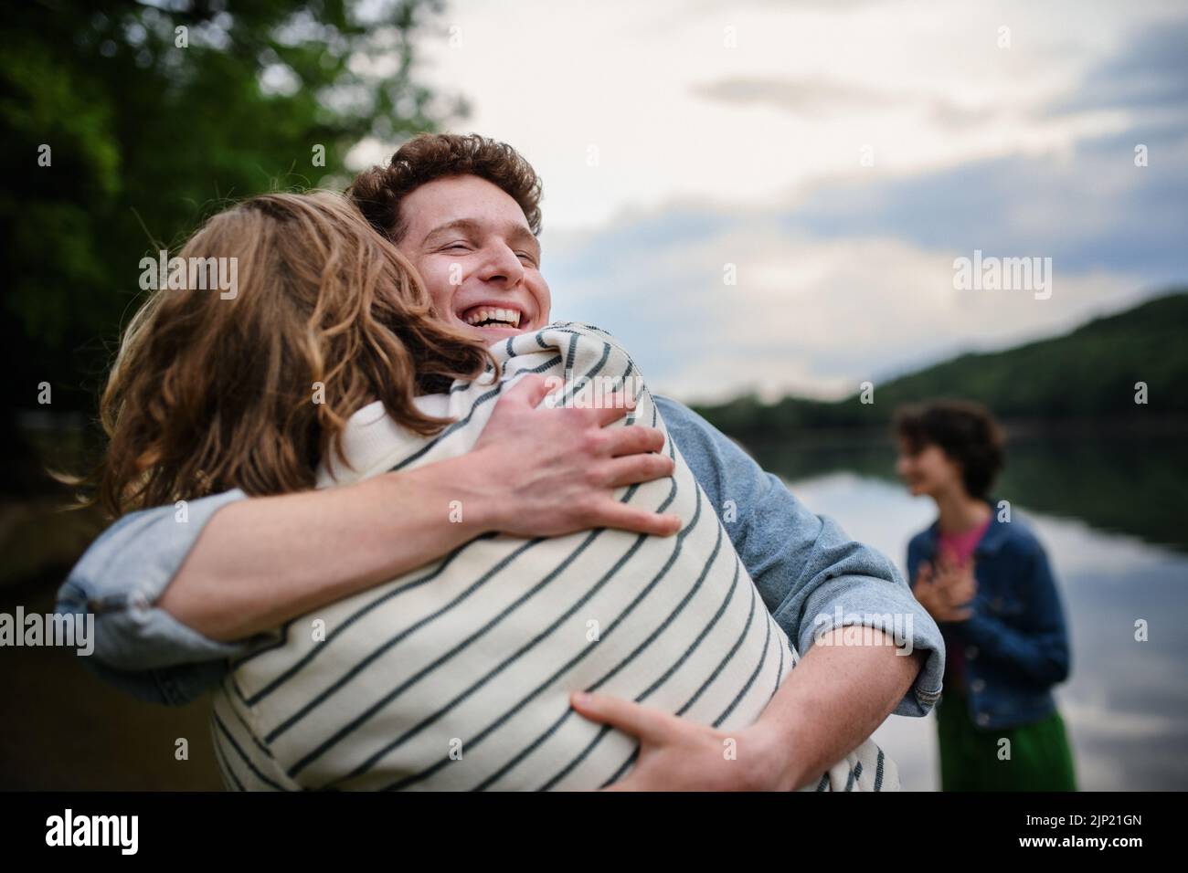 Friends having fun together at park lauging and hugging, Friendship and ...