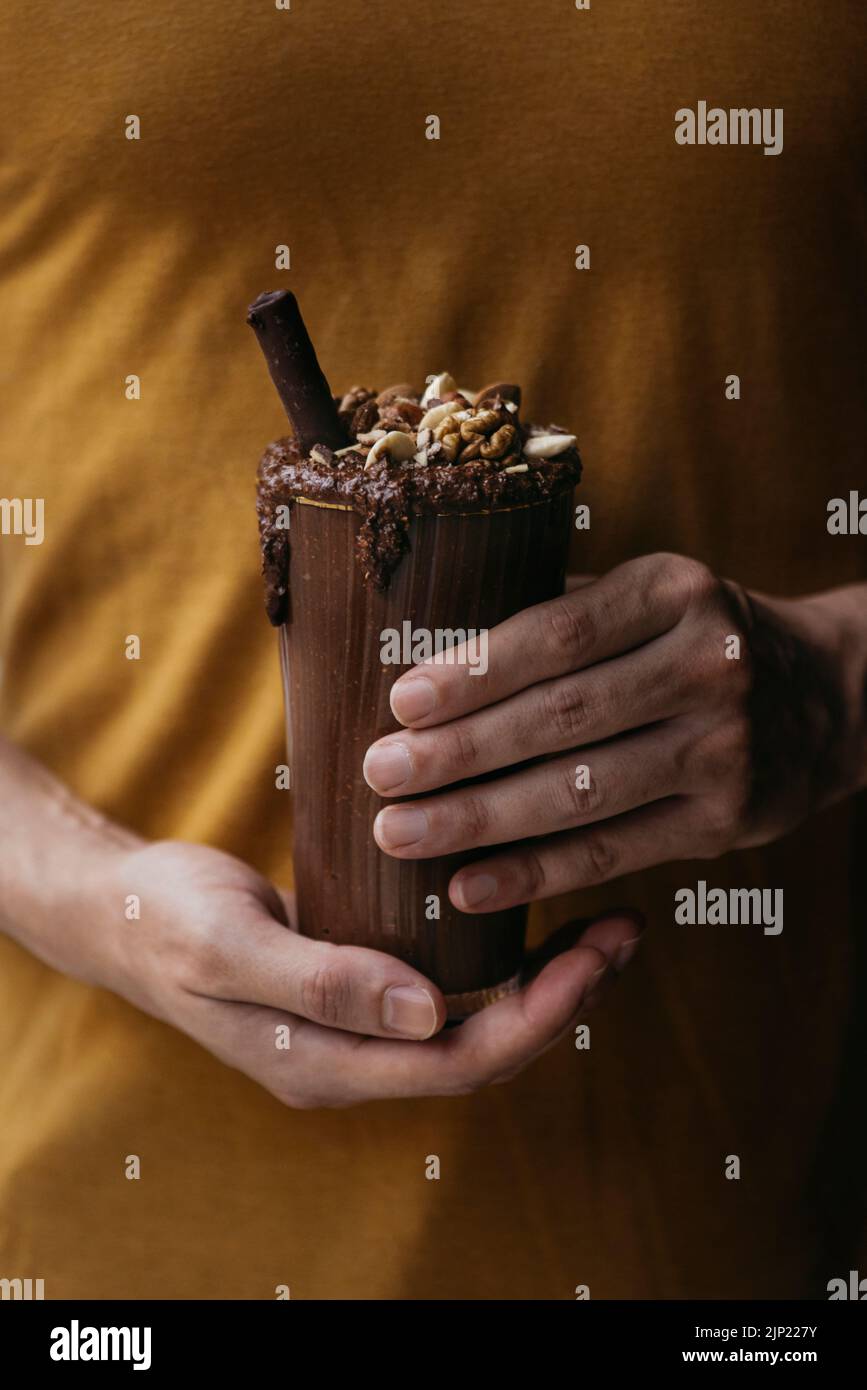Hand holding milk shake hi-res stock photography and images - Alamy