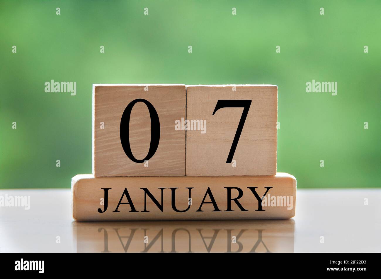 January 7 calendar date text on wooden blocks with blurred background ...