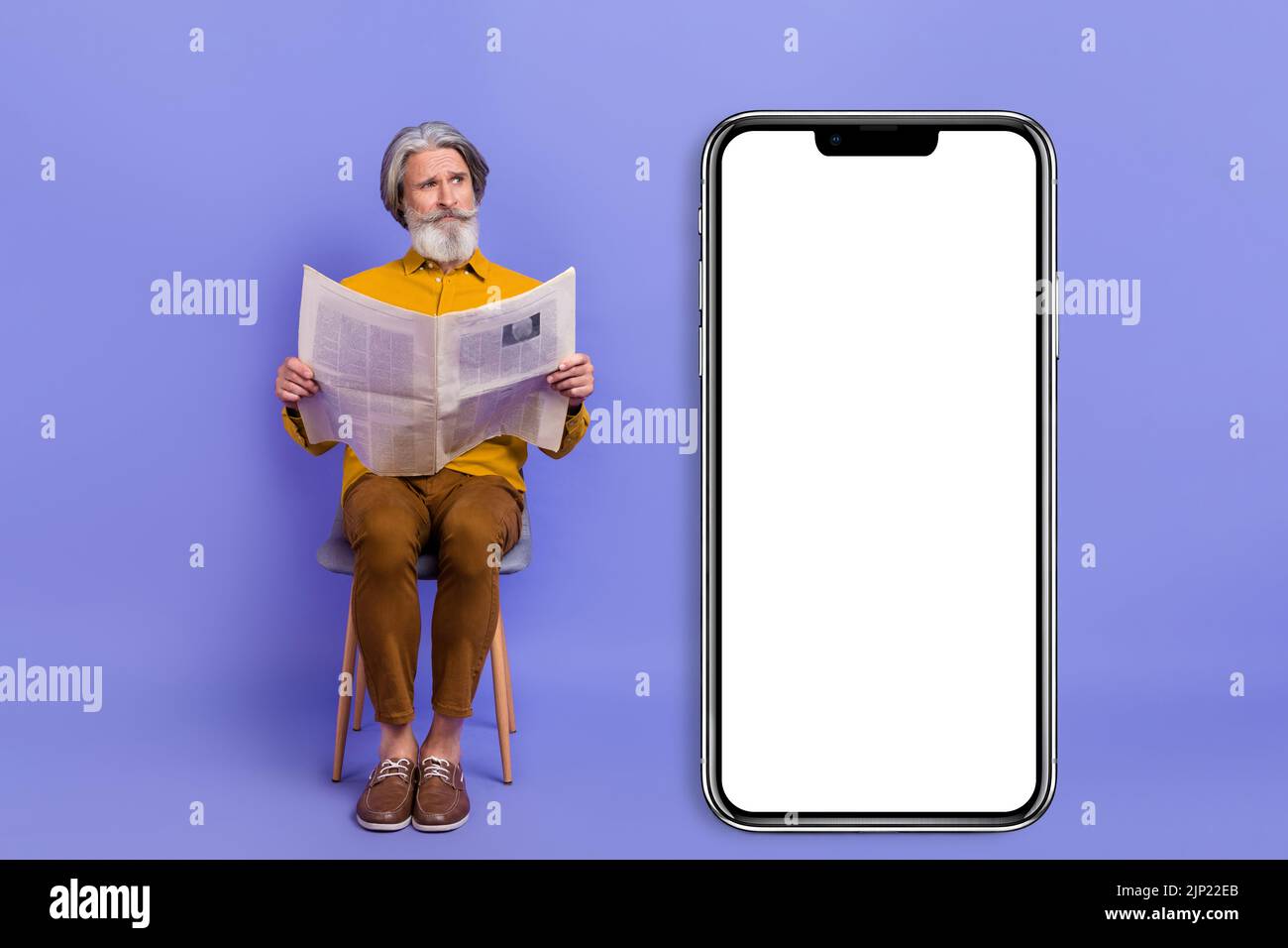 Portrait of attractive doubtful gray-haired man reading news copy space ...