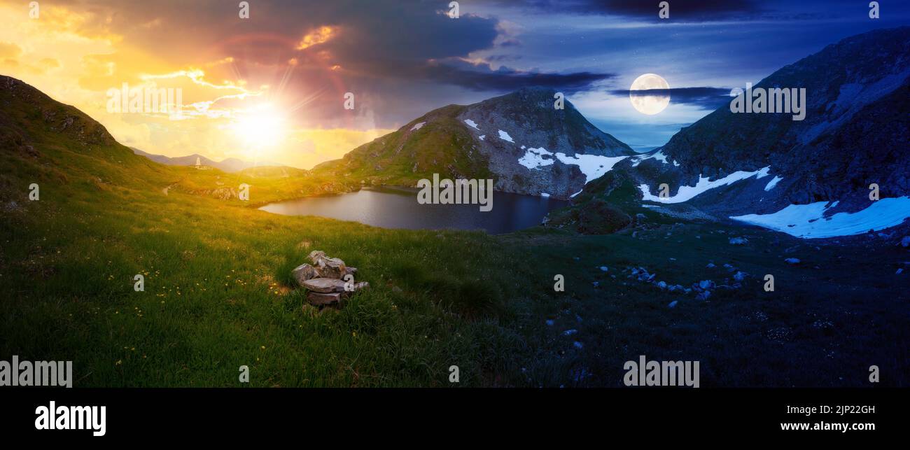 high altitude mountain lake at twilight. day and night time change ...