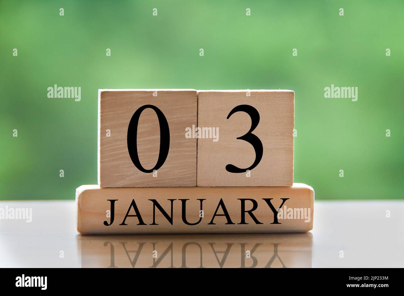 January 3 calendar date text on wooden blocks with blurred background ...