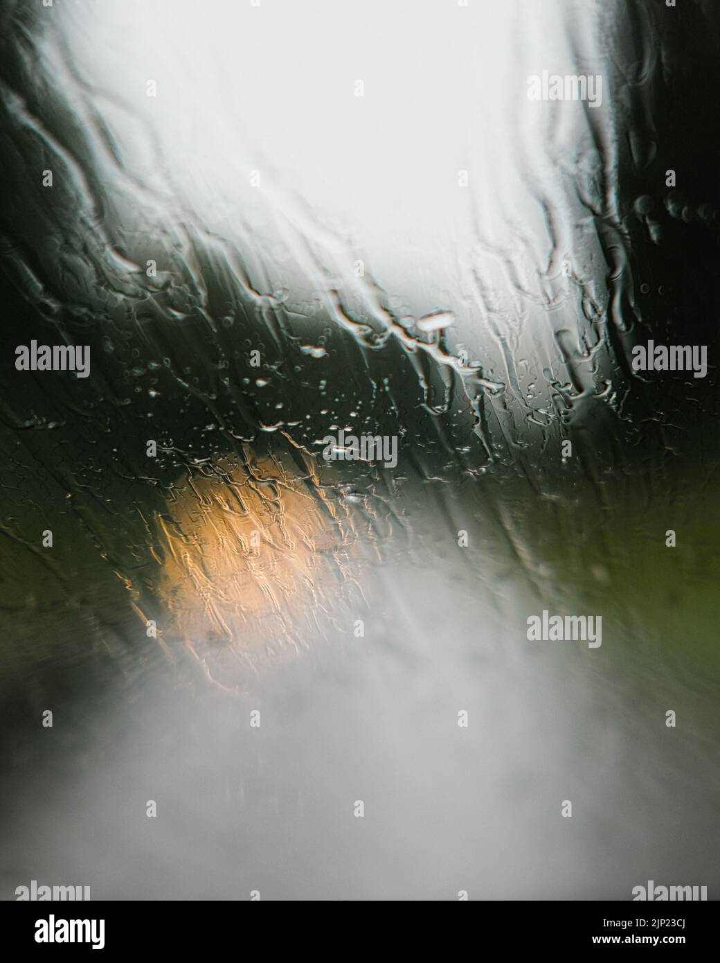 Blurry light and raindrops on a window in heavy rain Stock Photo - Alamy