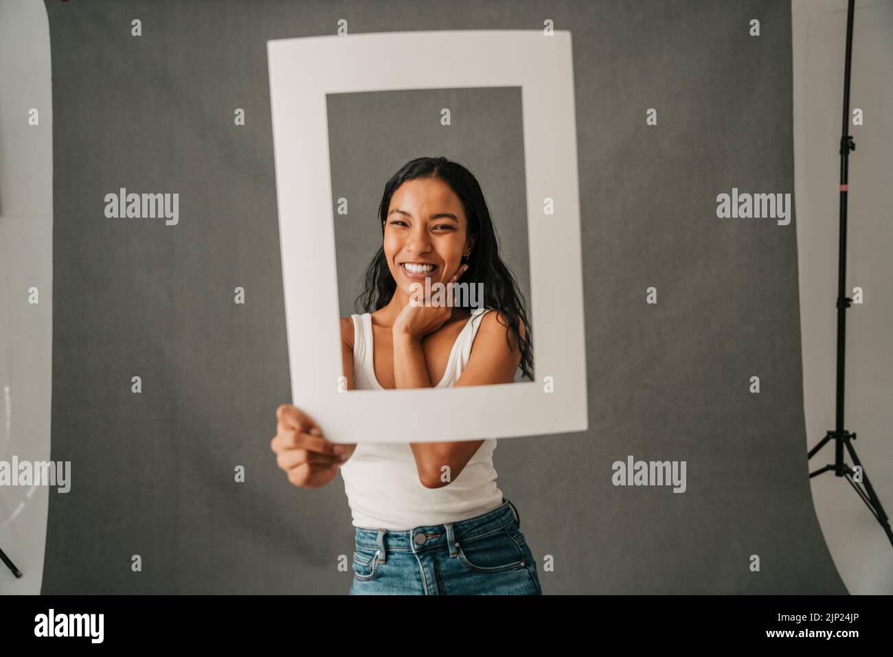 African American female framing her face with a white frame Stock Photo ...