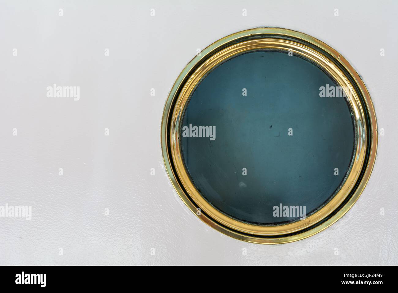 A Bull's eye window on a ship with copy space Stock Photo - Alamy