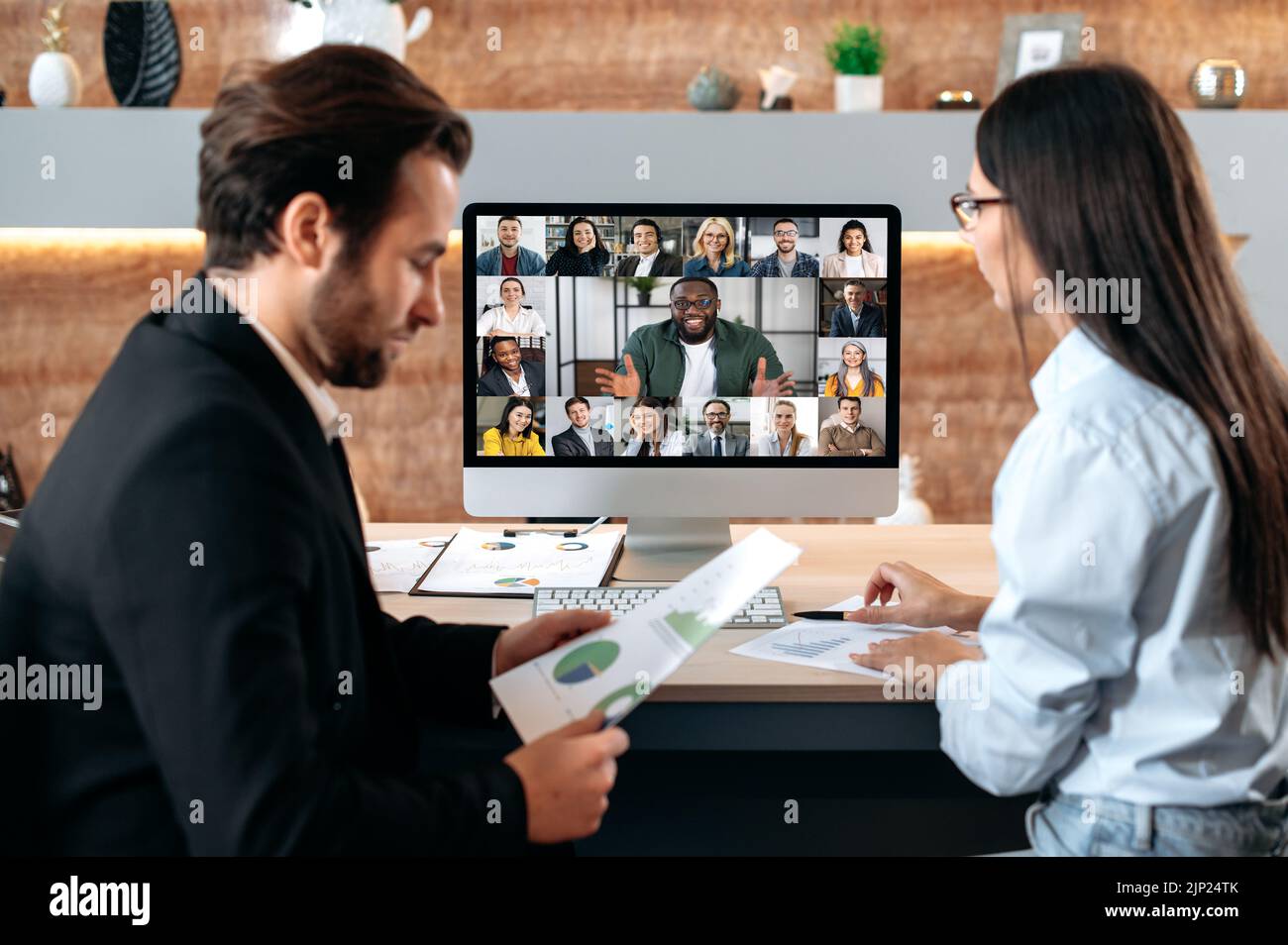 Business collaboration, caucasian man and woman, sit in a modern office ...
