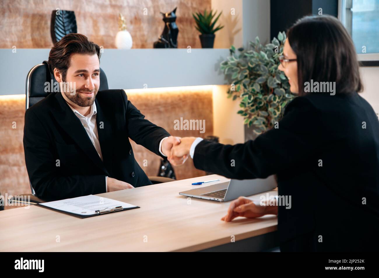 Cooperation, agreement. Successful caucasian business colleagues ...