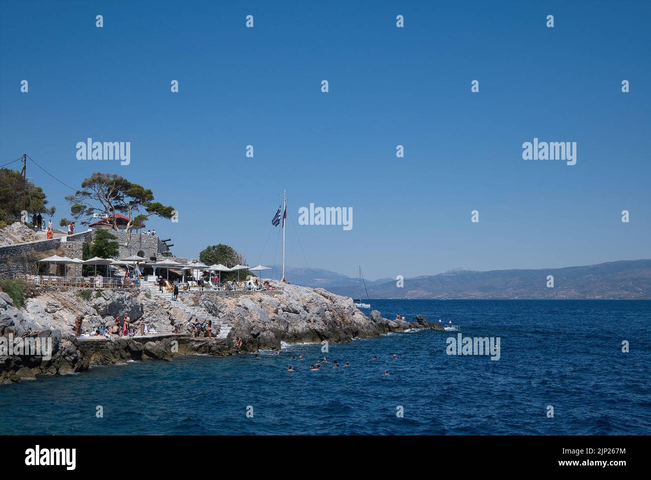 tourists swimming on the Island of Hydra in Greece in Summer Stock ...