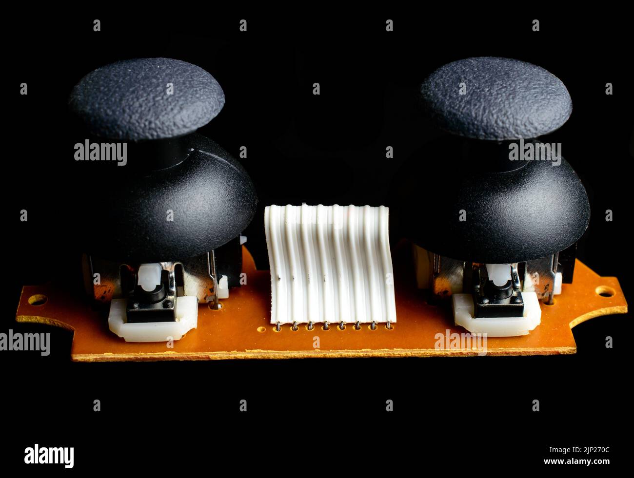 Double joystick on a black background. Macro photo. Background picture ...