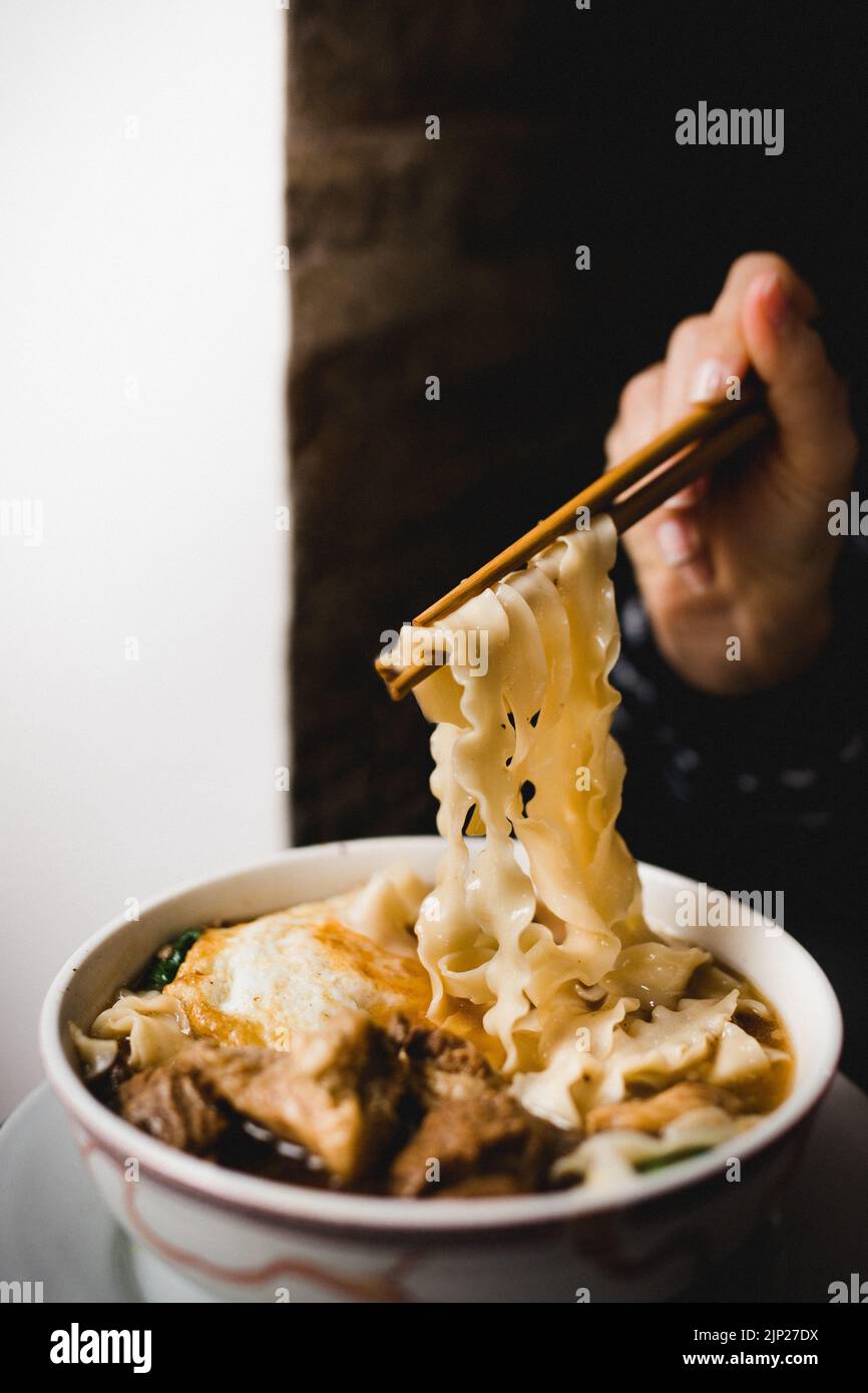 Chinese beef soup hand hi-res stock photography and images - Alamy