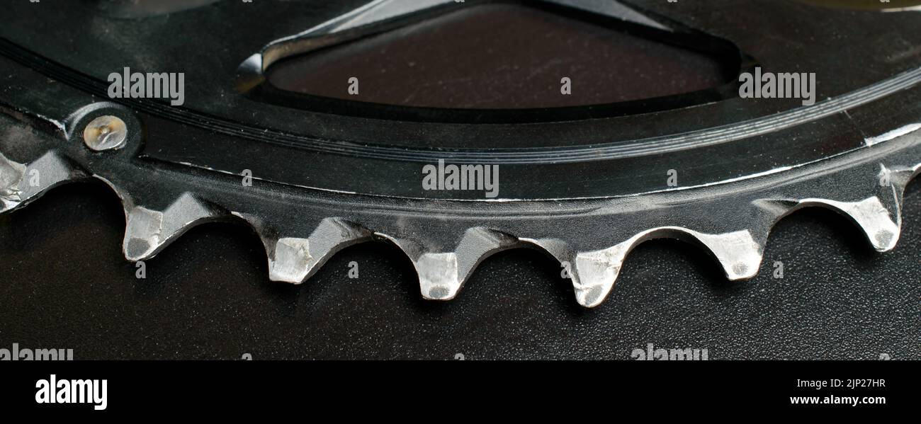 Road bike forward gear - 50 teeth. Worn our bicycle gear. Macro photo ...