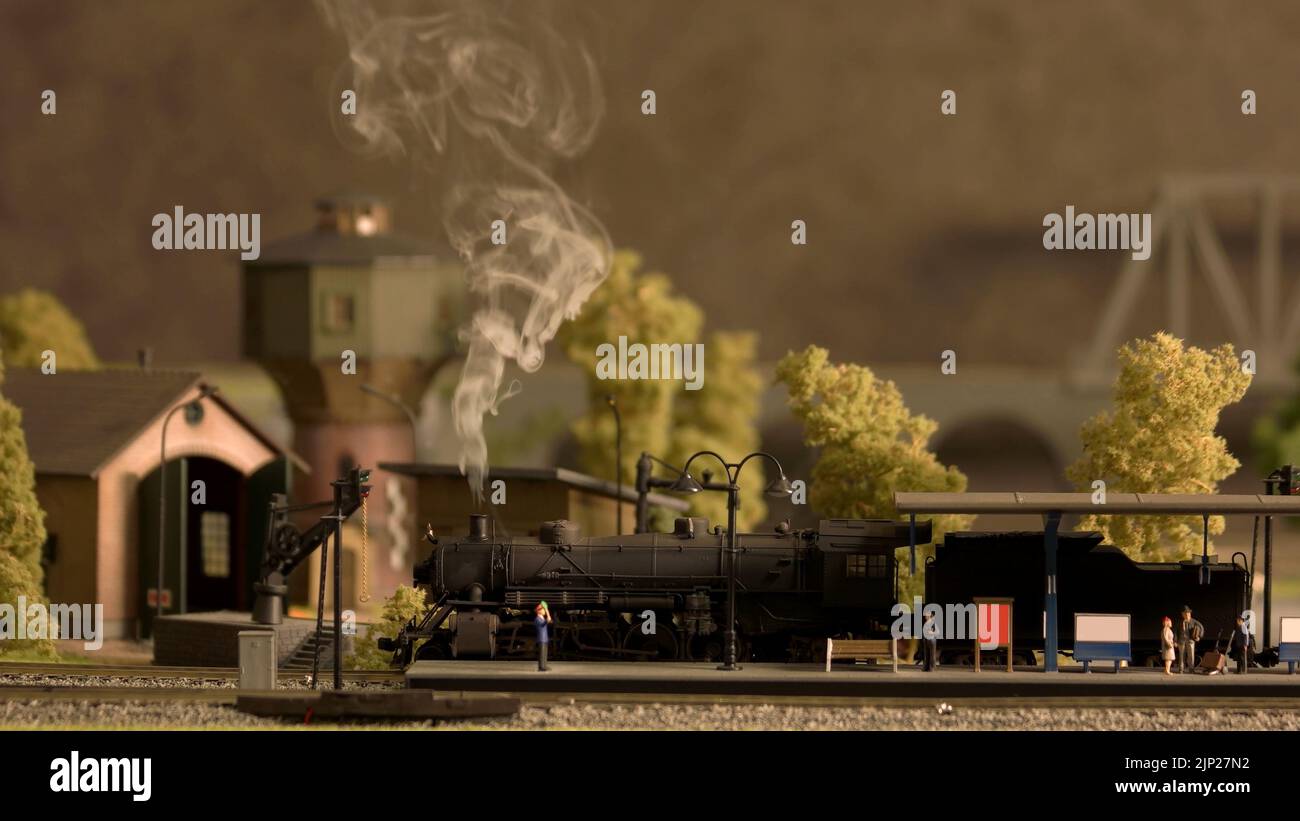 Model of steam locomotive carries the freight. Miniature of railway ...