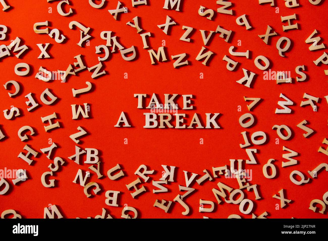 Quote TAKE A BREAK made out of wooden letters on bright red background ...