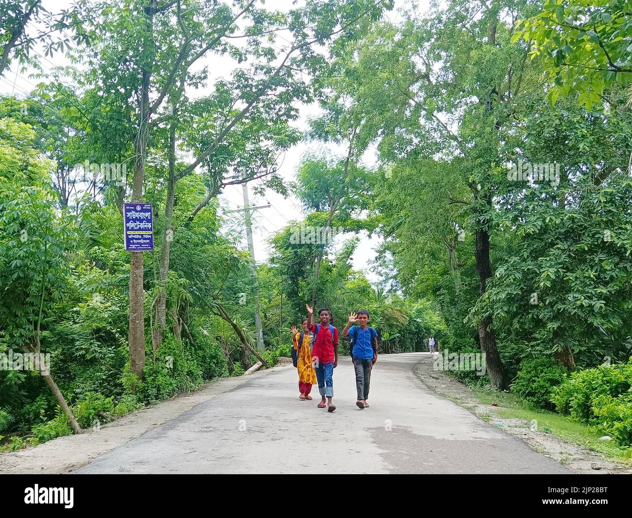 Barguna. 15th Aug, 2022. Children walk on a widened and reconstructed ...
