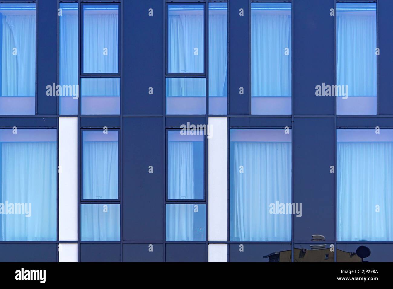 Blue glass windows with curtains at modern hotel building Stock Photo ...