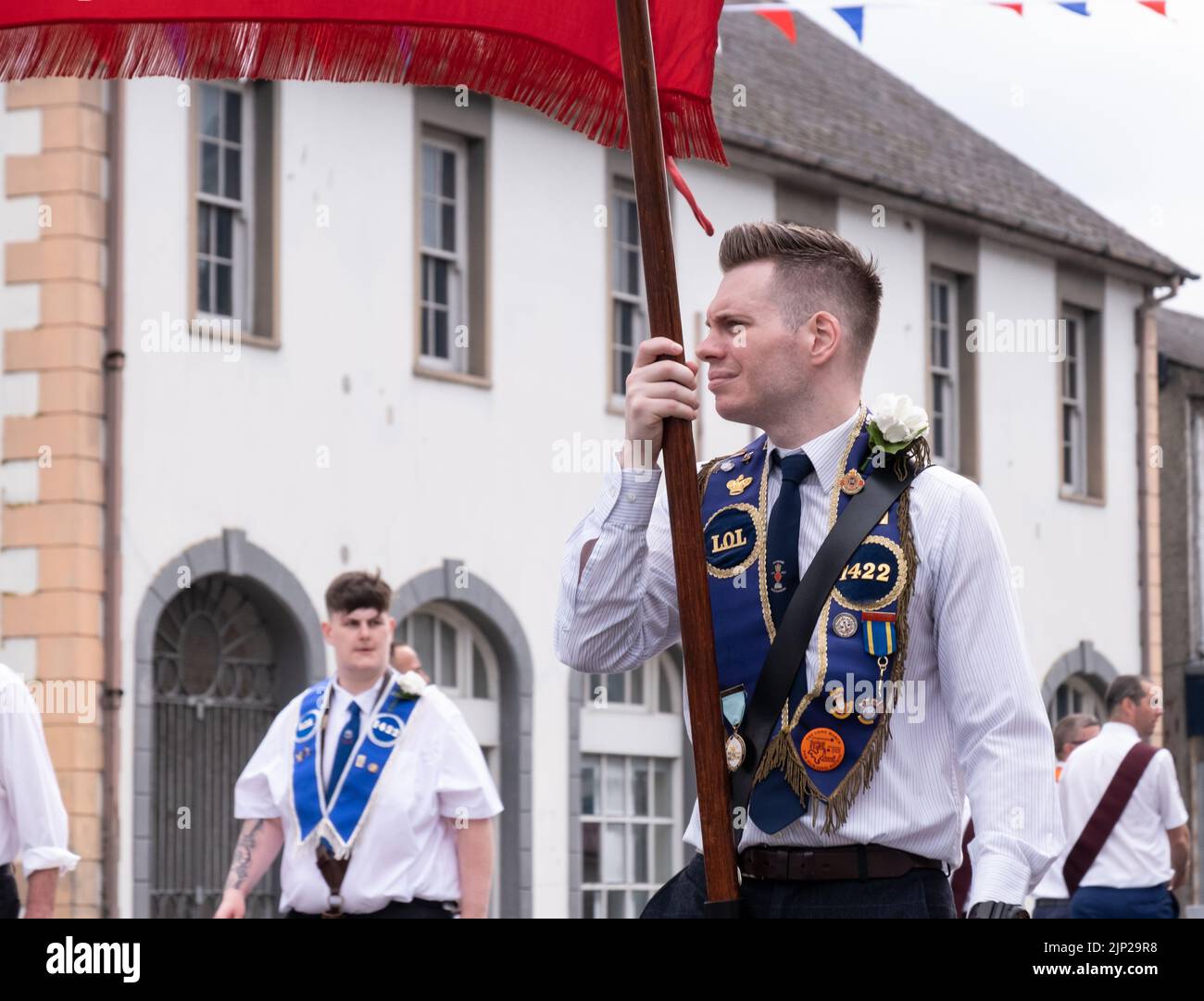 Antrim, 12th July 2022, UK. Orange Order banner being carried by a ...