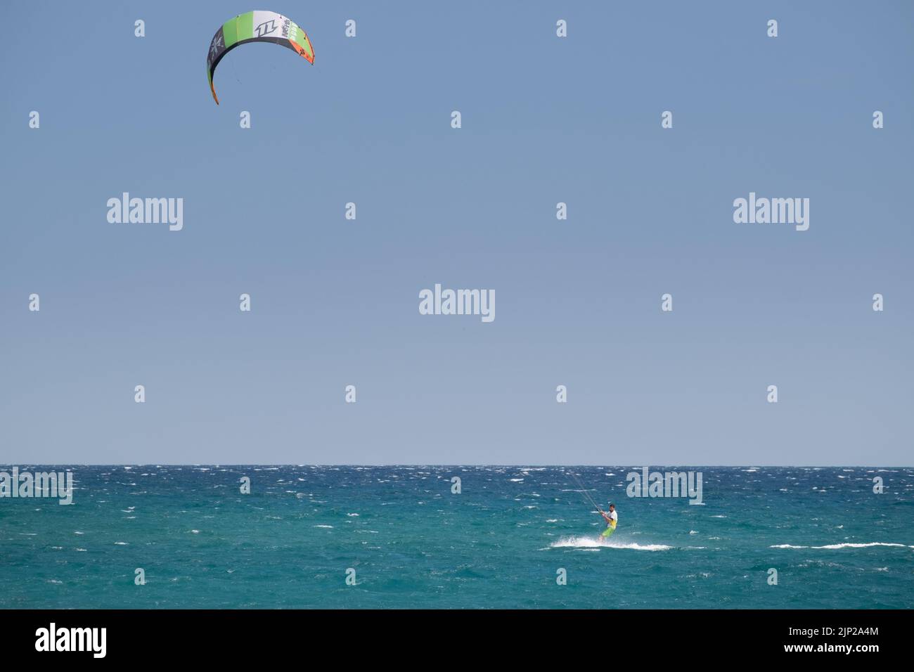 Man kitesurfing in Agiokampos beach of Aegean sea,Greece Stock Photo ...