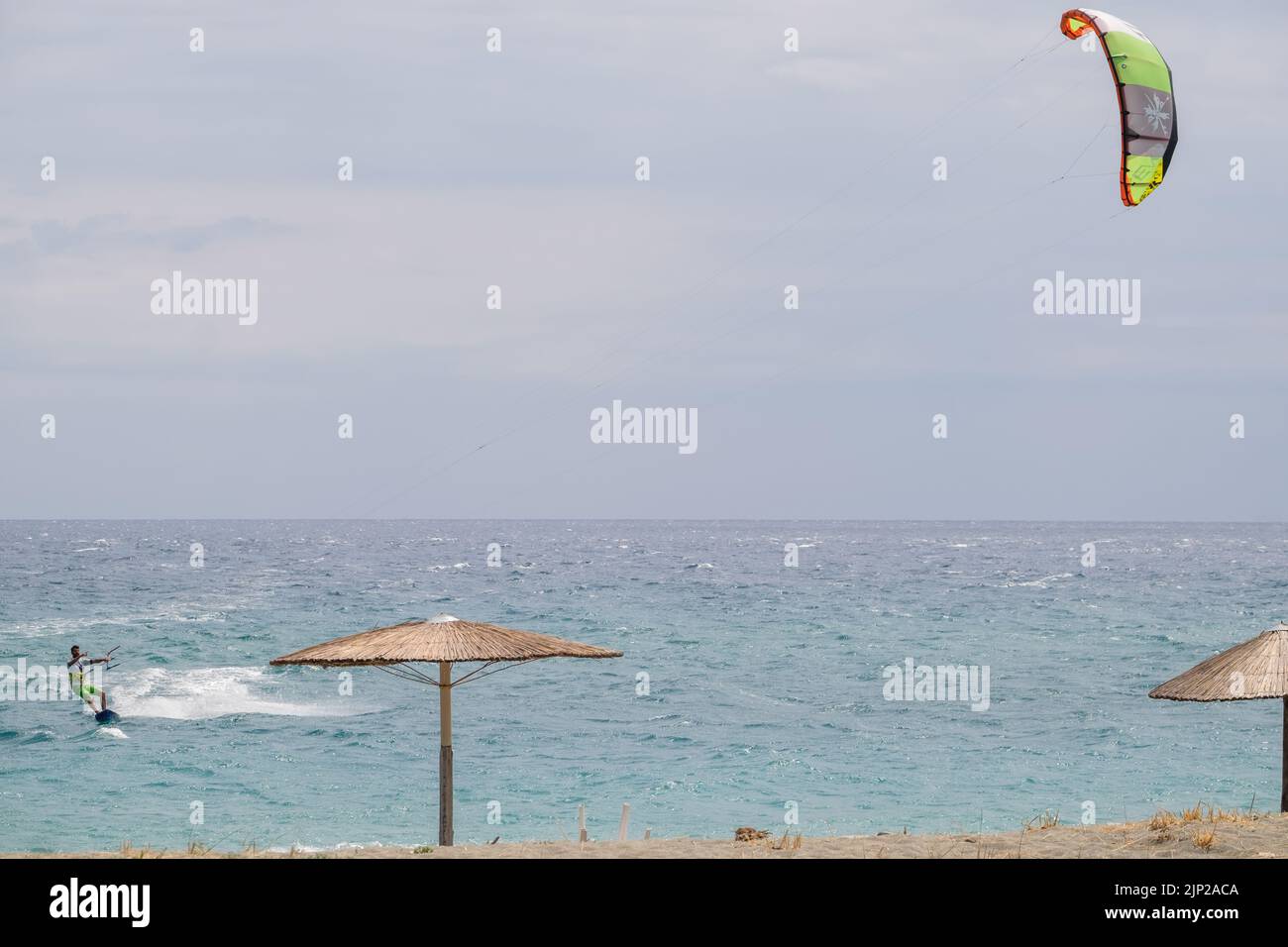 Man kitesurfing in Agiokampos beach of Aegean sea,Greece Stock Photo ...