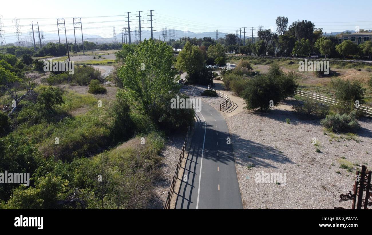 An aerial view of a highway road along green trees Stock Photo - Alamy