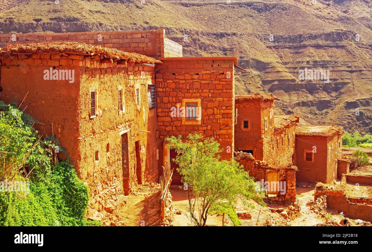 Hiking through idyllic beautiful lonely old clay house berber villages ...