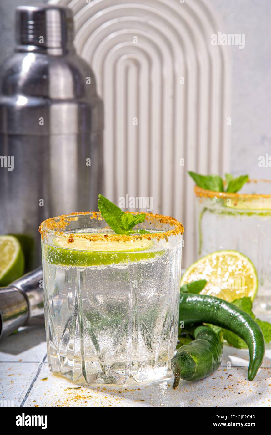 Spicy margarita or tequila cocktail with lime, chilli hot pepper and ...